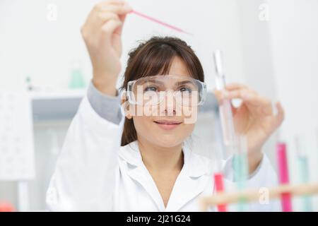 Lab assistant in drug synthesis concept Stock Photo - Alamy