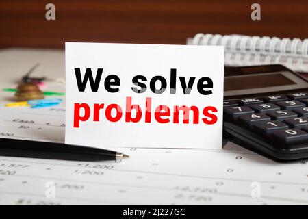 Notebook with text inside Problem Solving on table with coffee, laptop ...