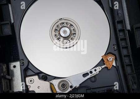 Mechanical parts of hard drive disk (HDD) inside a computer Stock Photo ...