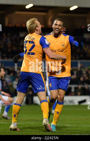 . Mansfield Town's Jordan Bowery in action with Barrow's James Jones ...
