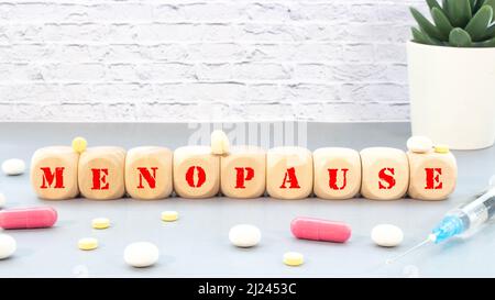 menopause word written on wood block. menopause text on table, concept ...