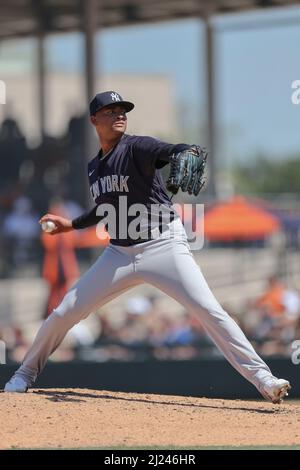 New York Yankees' Luis Gil, left, and Andy Pettitte, right, look on ...