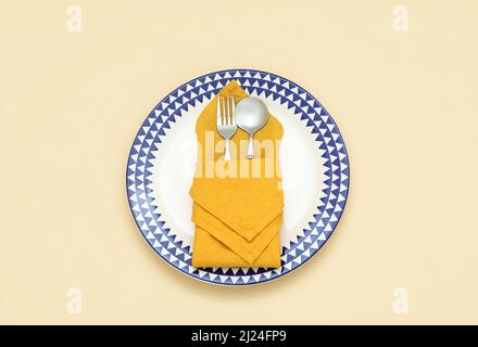 Simple table setting on beige background, closeup Stock Photo - Alamy