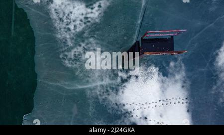 Wood duck tracks are scattered around this crude diving platform on a ...