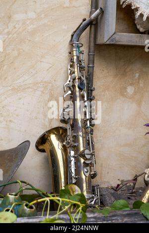 Jazz musical instrument saxophone with rusty fence background Stock ...