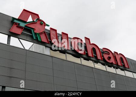This photograph shows the sign of a Auchan store at Velizy Villacoublay ...