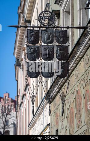 Poznan, Wielkopolska, Poland. Street sign and wall with flaking paint ...