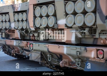 A multiple launch rocket system (MLRS) gunner operates the fire control ...