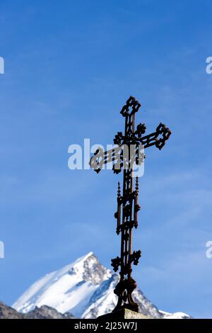 Catholic croos againt blue sky and moutain Stock Photo - Alamy