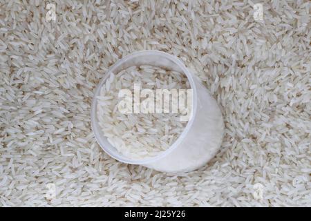 Rice for sale with a plastic cup Stock Photo - Alamy