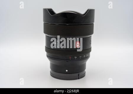 A closeup shot of full frame lens of Sony camera isolated on the white ...