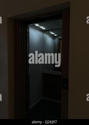 shot at night of a elevator open doors in a empty floor, night ...