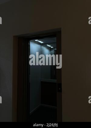 shot at night of a elevator open doors in a empty floor, night ...
