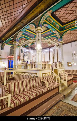 The centrally placed square bima at the Bikur Holim Jewish synagogue ...