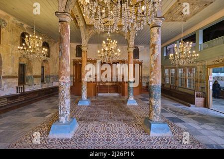 The synagogue space, with central bima. Restoration stripped past paint ...