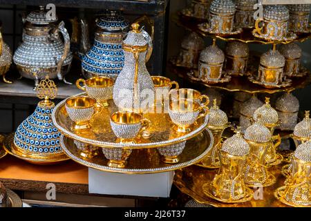 Traditional tea sets at Grand Bazaar in Istanbul, Turkey. Golden color ...