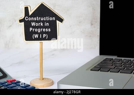 notebook & house model on wooden desk. realtor real estate agent ...