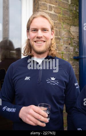 Cambridge Men's President Luca Ferraro lifts the trophy as they ...