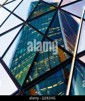 Ultra-modern skyscrapers in Aldgate, London, reflecting the cloudscape ...