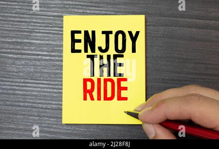 LIFE IS A JOURNEY ENJOY THE RIDE motivational quote. Yellow paint line ...