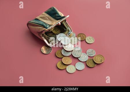 Concept background of Ruble coins spilled out of small purse on dark ...