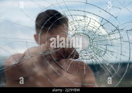 Ready to fight cracked glass. Fist punch. Man boxing, strength and ...