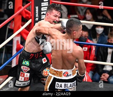 Andy Hiraoka (black glove) and Cristiano Aoqui (silver glove) competes ...