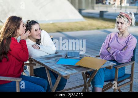 Unhappy Girl Being Gossiped About By School Friends In Classroom Stock ...