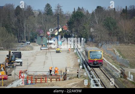 Blankenfelde Mahlow, Germany. 31st Mar, 2022. A worker walks next to ...