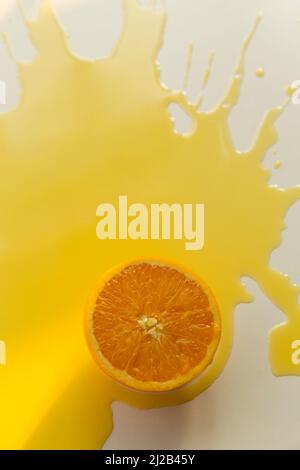 Creative photography, orange and spilled orange juice Stock Photo - Alamy