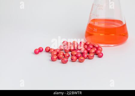 Treated soybean seed and laboratory beaker. Soybean seed treatment for ...