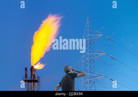 Gas flare stack and electricity pylon. Cost of living crisis, rising ...