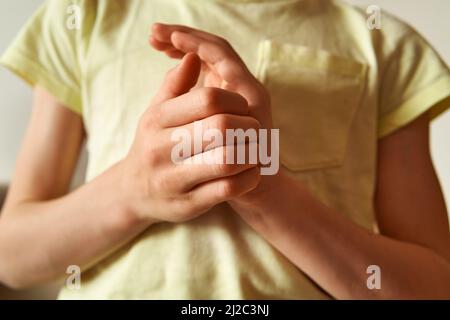 Little boy practicing EFT or emotional freedom technique - tapping on ...