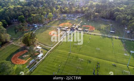 An aerial shot of soccer and baseball fields with trees around Stock ...