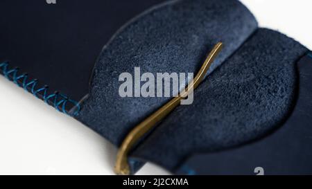Open blue men's money clip handmade leather wallet. Close up. Empty ...