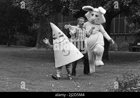 Magician Paul Daniels with his co-stars in the Children's BBC programme ...