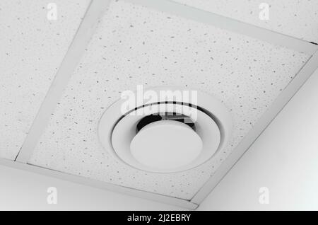 Round ventilation duct on the ceiling. Modern ventilation built into ...