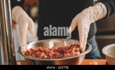 A view of human hands mixing minced meat in kitchen Stock Photo - Alamy