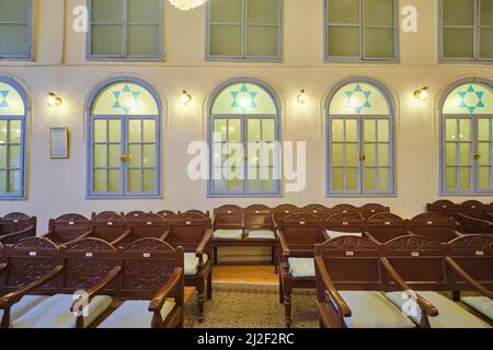 A look at the various rows of wood seating, benches along the side of ...