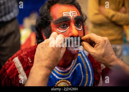 Make-up artist working to transform a man to the avatar of Virabhadra ...