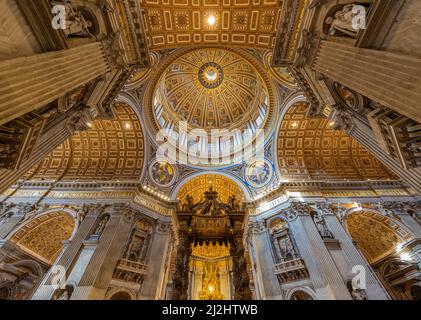A picture of the huge dome of the St. Peter's Basilica, the altar and the surrounding frescoes ...