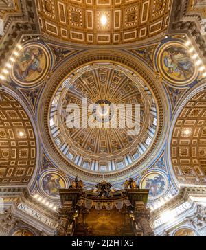 A picture of the huge dome of the St. Peter's Basilica, the altar and the surrounding frescoes ...
