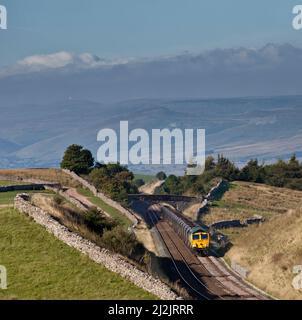 Freightliner class 66 locomotive 66951 hauling a merry go round coal ...