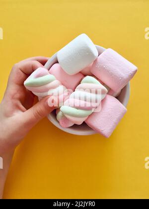 Child reaching into bowl, overhead view Stock Photo - Alamy