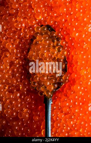 Close-up of a spoonful of red trout caviar Stock Photo - Alamy