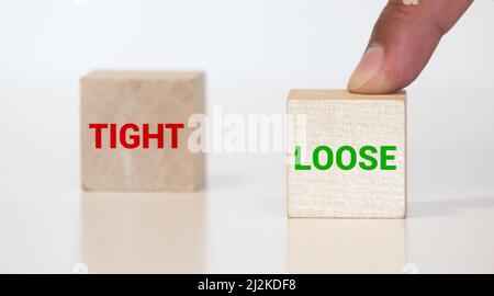 Street Sign the Direction Way to Tight versus Loose Stock Photo - Alamy