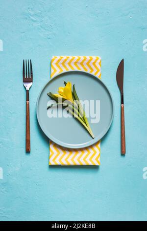 Festive table place setting with spring blossoming branch on wooden ...