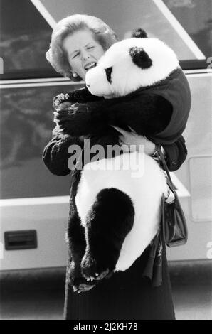 Prime Minister Margaret Thatcher with a teddy bear, presented to her at ...
