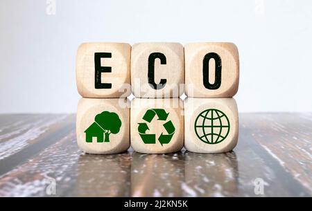 Eco word written from a wooden cubes with letters on a yellow ...