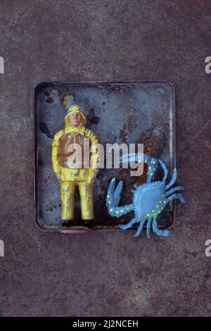 Plastic model of blue crab on tarnished metal Stock Photo - Alamy